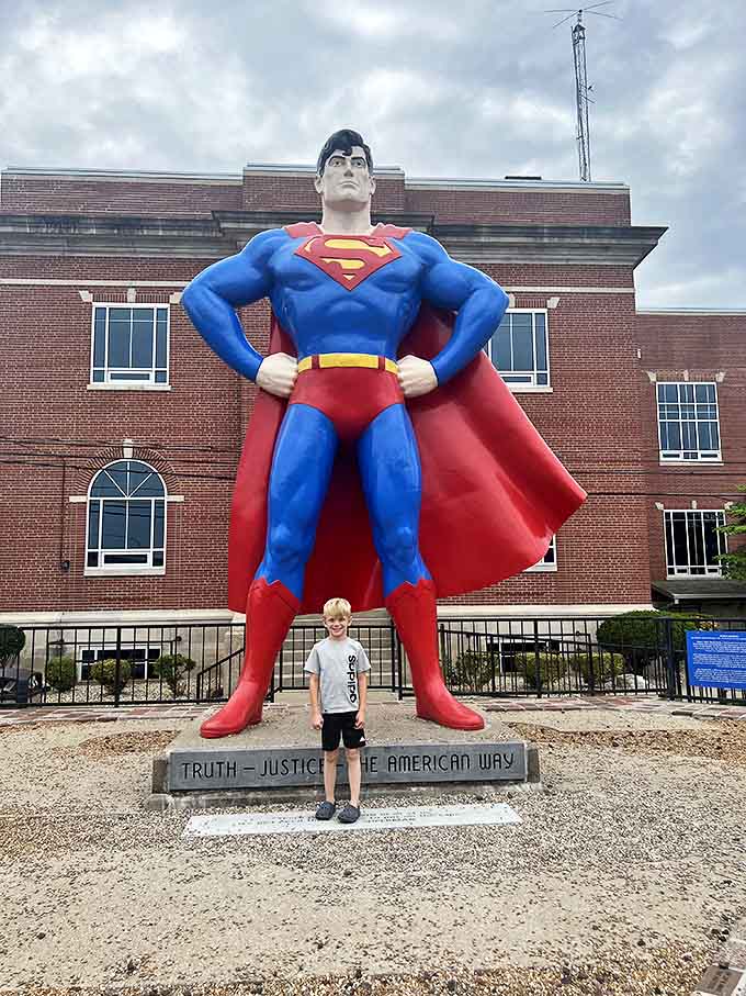 The World's Largest Superman Statue stands 15 feet tall in Metropolis, Illinois, striking his iconic pose against the backdrop of small-town America.