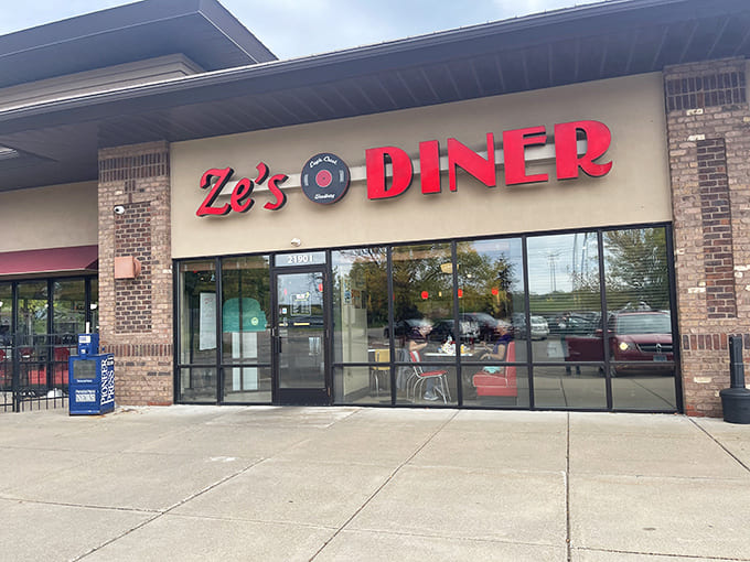 Exterior: Ze's Diner's brick facade and bold red signage promise a time-traveling adventure that begins the moment you pull into the parking lot.