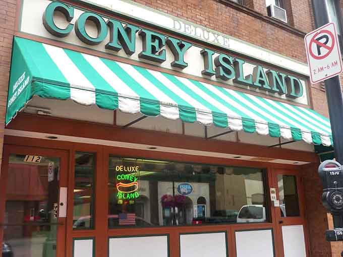 The iconic green and white striped awning of Deluxe Coney Island stands as a beacon of comfort food in downtown Duluth.