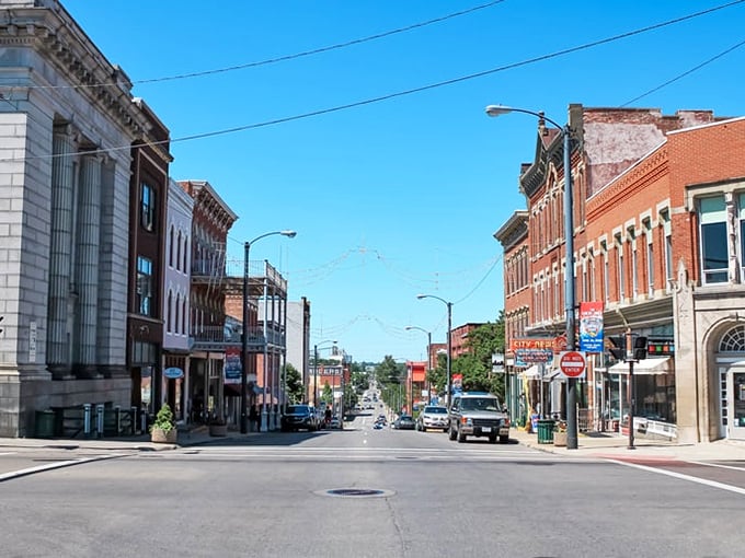 Downtown Mansfield welcomes visitors with its charming historic architecture, where brick buildings house culinary treasures waiting to be discovered on sun-drenched streets.