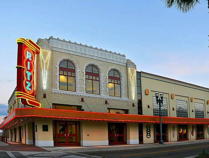 The iconic Ritz Theatre facade glows with vintage charm, its red marquee a beacon of entertainment history in Jacksonville's LaVilla neighborhood.