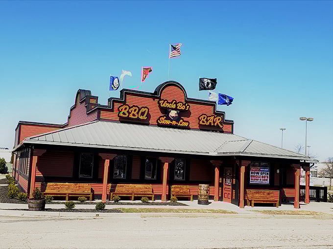 Uncle Bo's exterior stands proud against the Ohio sky, its rustic charm and fluttering flags beckoning hungry travelers like a barbecue lighthouse in a sea of chain restaurants.