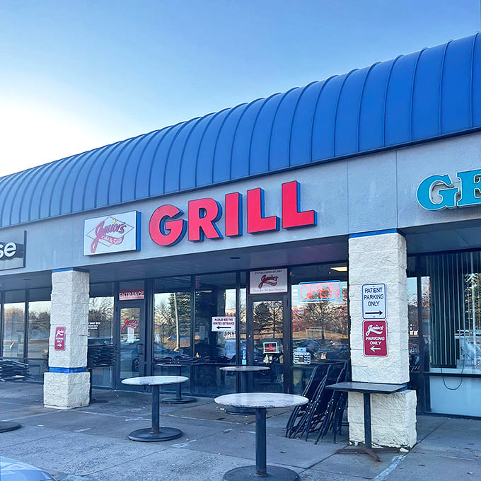The iconic blue roof and bold red "GRILL" sign of Junior's beckons hungry travelers like a neon-lit lighthouse for the breakfast-starved.