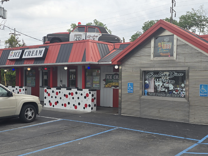 The iconic Speedtrap Diner exterior with its vintage police cruiser perched on the roof &ndash; a cheeky nod to Woodville's traffic enforcement reputation.