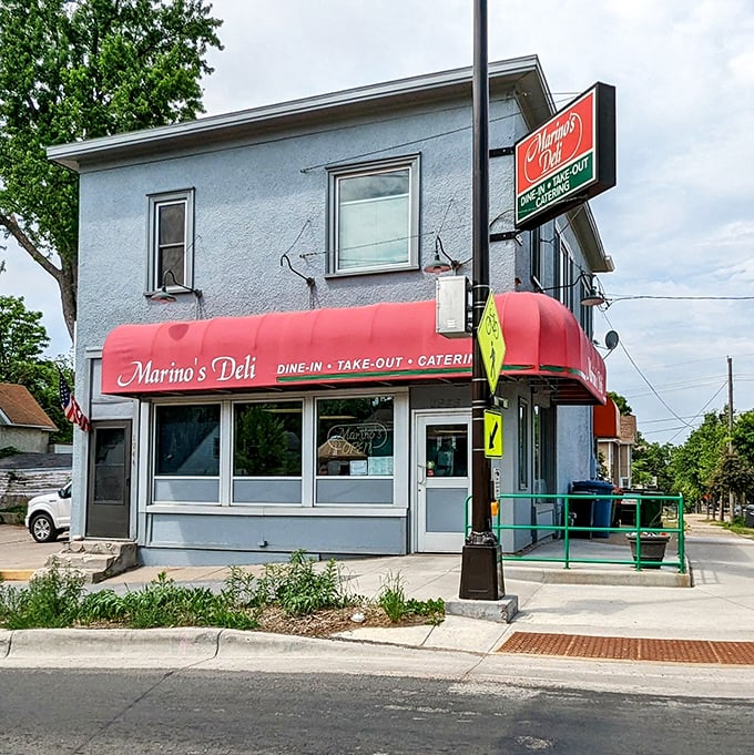 The iconic blue building with its welcoming red awning stands as a beacon for sandwich lovers in Northeast Minneapolis.