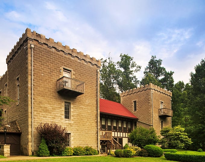 The imposing stone facade of Ravenwood Castle emerges from the Hocking Hills forest like a medieval dream transported to modern-day Ohio.
