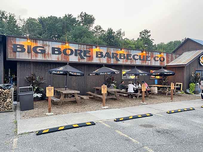 The weathered wooden exterior of Big Bore Barbecue stands like a rustic temple to smoked meat, promising authentic Texas flavors in Minnesota's heartland.
