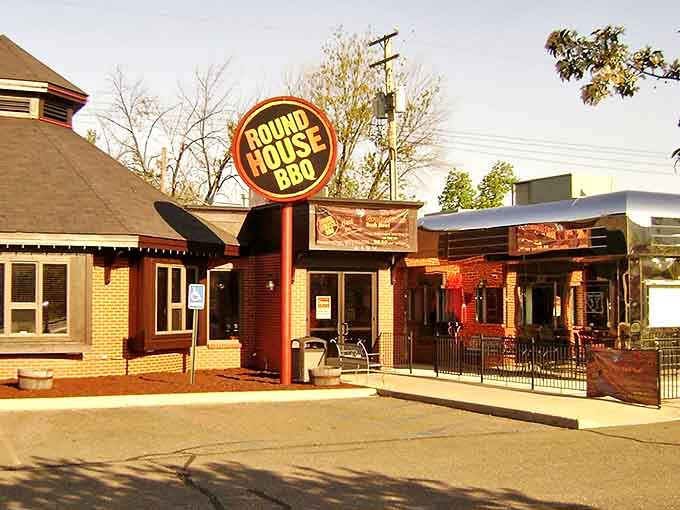 The iconic Round House BBQ sign welcomes hungry visitors, promising smoky delights that have made this Trenton landmark a must-visit destination.