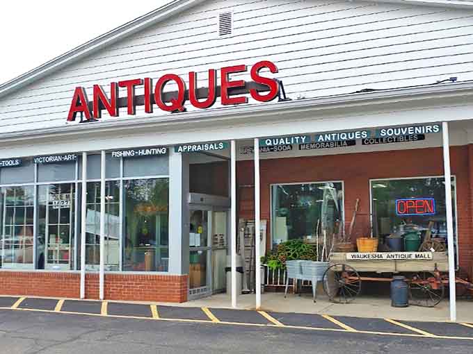 The bold red "ANTIQUES" sign beckons like a siren call to treasure hunters and nostalgia seekers alike.