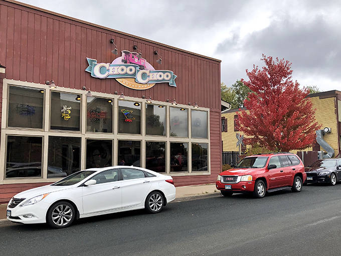 The distinctive burgundy exterior of Choo Choo Restaurant & Bar stands out in Loretto, Minnesota, promising a dining adventure beyond the ordinary.
