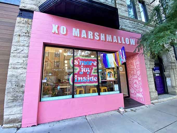The vibrant pink storefront of XO Marshmallow beckons like a sweet beacon in Chicago, promising "S'more Joy Inside" to all who enter.