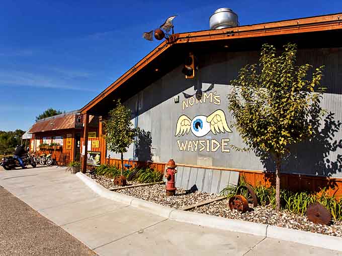 Norm's Wayside exterior welcomes hungry travelers with rustic charm and the promise of oversized comfort food that'll make your cardiologist wince with delight.