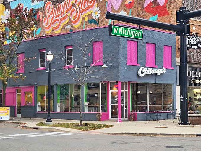 Chilango's eye-catching exterior pops with hot pink trim against slate gray, a colorful beacon for hungry travelers on W. Michigan Avenue.