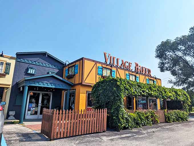 The charming Tudor-style exterior of Village Baker beckons with its mustard-yellow facade and climbing ivy &ndash; a storybook bakery come to life.