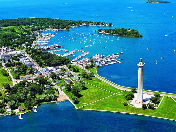 From above, Put-in-Bay reveals its perfect harbor dotted with boats while Perry's Monument stands sentinel over this Lake Erie paradise.
