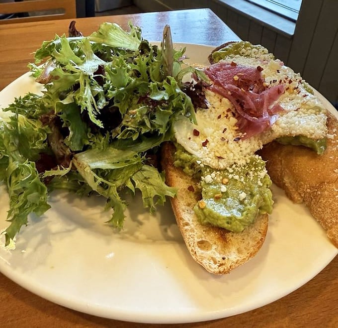Avocado toast that transcends its trendy reputation &ndash; perfectly toasted bread, creamy avocado, and thoughtful garnishes that make Instagram jealous.