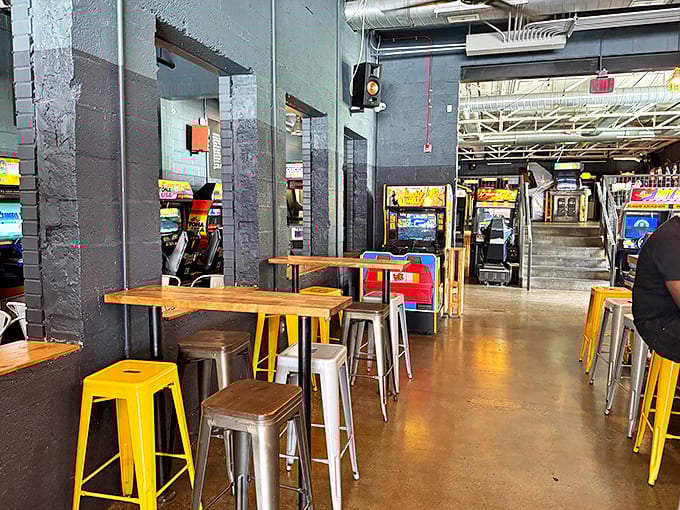 Industrial-chic seating areas provide perfect perches for strategic gaming breaks and refueling missions.