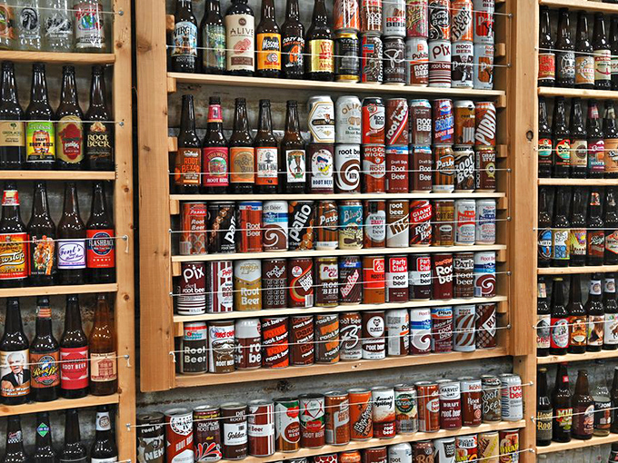 A mannequin shops for root beer treasures beside a classic blue refrigerator &ndash; a playful nod to America's consumer culture.