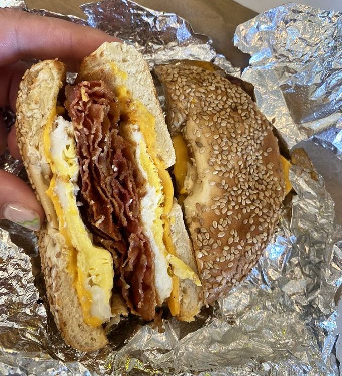The breakfast sandwich on a sesame bagel proves that while croissants get the glory, every bread option here deserves its moment.