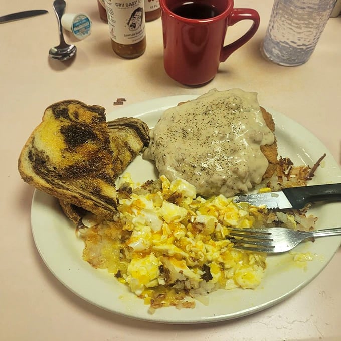Chicken fried steak smothered in country gravy&mdash;a dish so comforting it's like getting a hug from your favorite aunt who doesn't care about cholesterol.