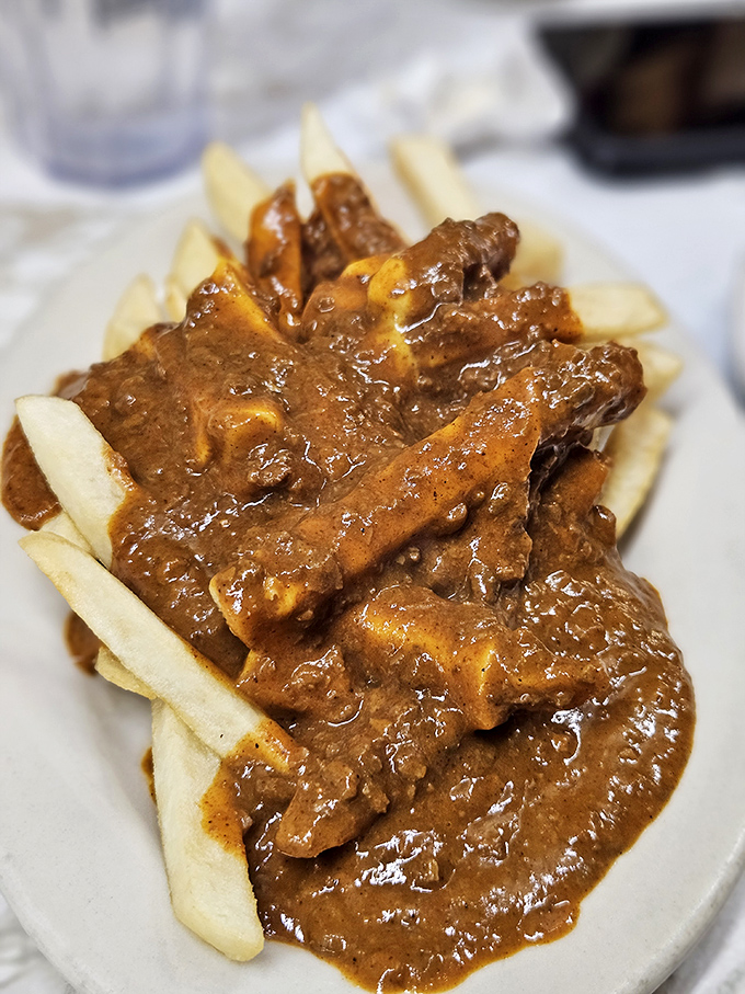 Chili cheese fries that laugh in the face of diet plans &ndash; a mountain of crispy potatoes smothered in that legendary Coney sauce.