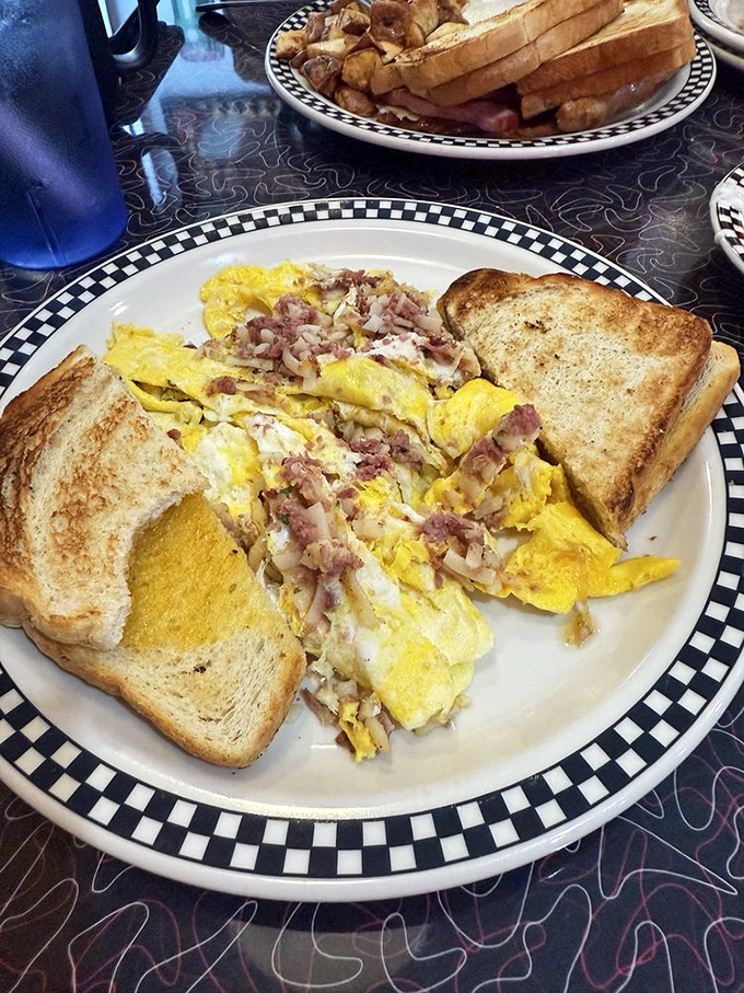 The corned beef hash scramble is a beautiful mess of savory deliciousness – house-made corned beef mingling with fluffy eggs and crispy potatoes.