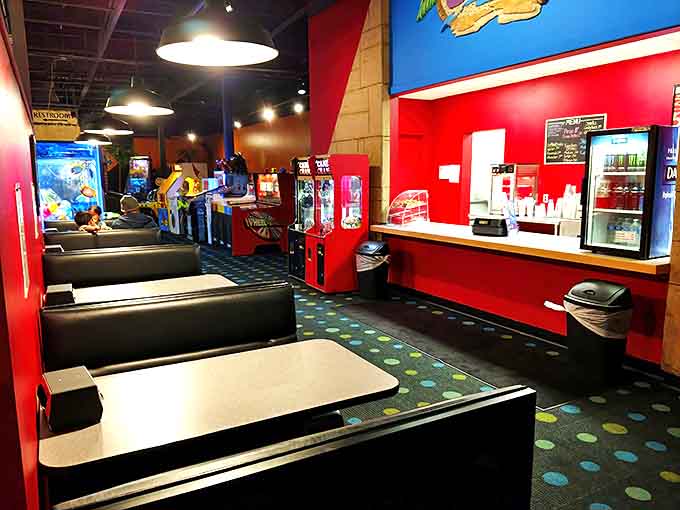 Refuel between gaming battles in these cozy booths where pizza tastes better under the glow of neon and victory.