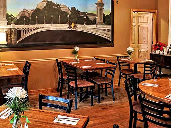 Sunlight streams through windows illuminating red tables where countless conversations, first dates, and family meals have unfolded over the years.