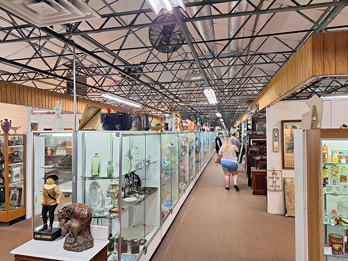 Endless possibilities stretch down this aisle of display cases, where treasures large and small await discovery by eagle-eyed collectors.