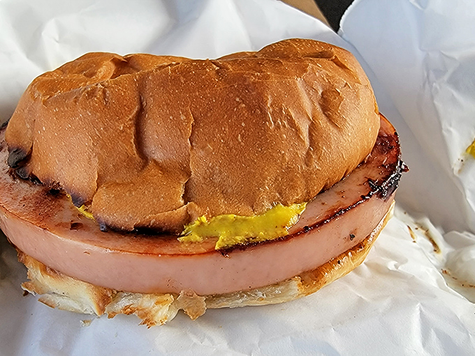 Fried Bologna: Thick-cut bologna grilled until the edges curl up, topped with melty cheese &ndash; childhood nostalgia never tasted so good.