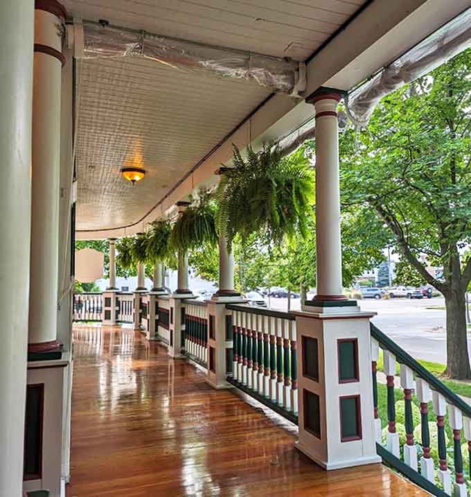 Front Porch: The quintessential porch experience awaits, where hanging ferns sway gently and rocking chairs practically whisper "sit down and stay awhile."
