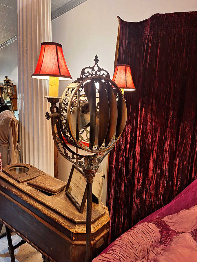 Elaborate drapery and lighting created the solemn ambiance expected in funeral settings &ndash; notice how the gold trim catches the light.