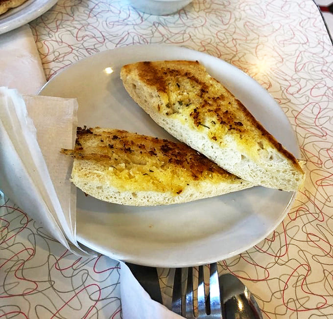 Garlic toast – simple yet executed with precision that transforms the ordinary into extraordinary, with just the right amount of buttery garlic goodness.