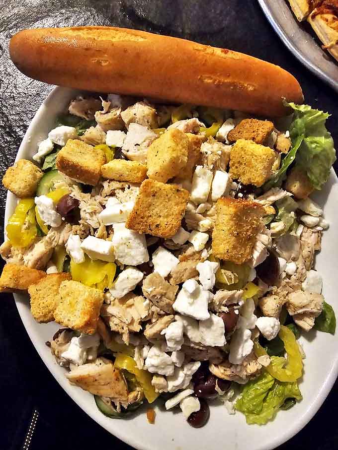 The Greco salad offers a fresh alternative for lighter appetites, with feta, olives, and grilled chicken creating Mediterranean magic in Minnesota.