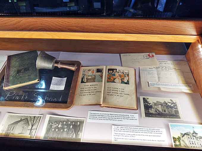 The Piatt School display features a vintage bell, primer, and photographs &ndash; reminders of education's evolution since the castle's 19th-century beginnings.