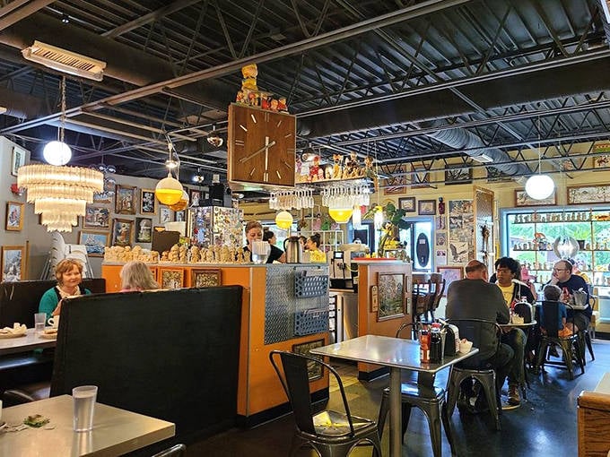 Metal chairs and wooden tables create an industrial-meets-homey vibe. The vintage clock collection reminds you that time moves differently when you're enjoying every bite.