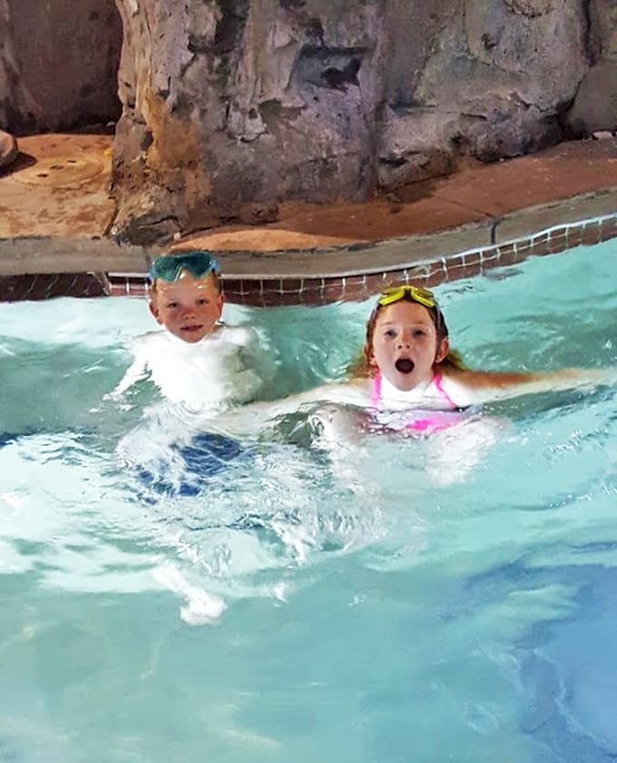 Pure aquatic joy radiates from these young swimmers, their expressions capturing that perfect vacation moment parents try desperately to bottle up.