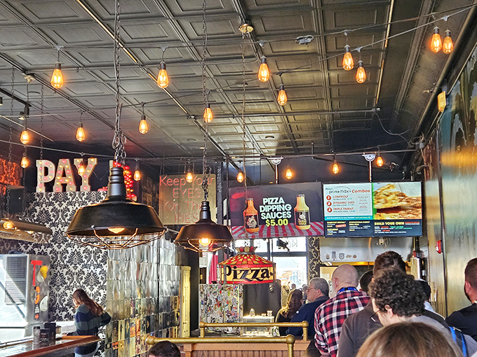 Pendant lights cast their glow over hungry patrons lining up for their fix &ndash; the dinner rush at Mikey's is a beautiful chaos orchestrated with pizza precision.
