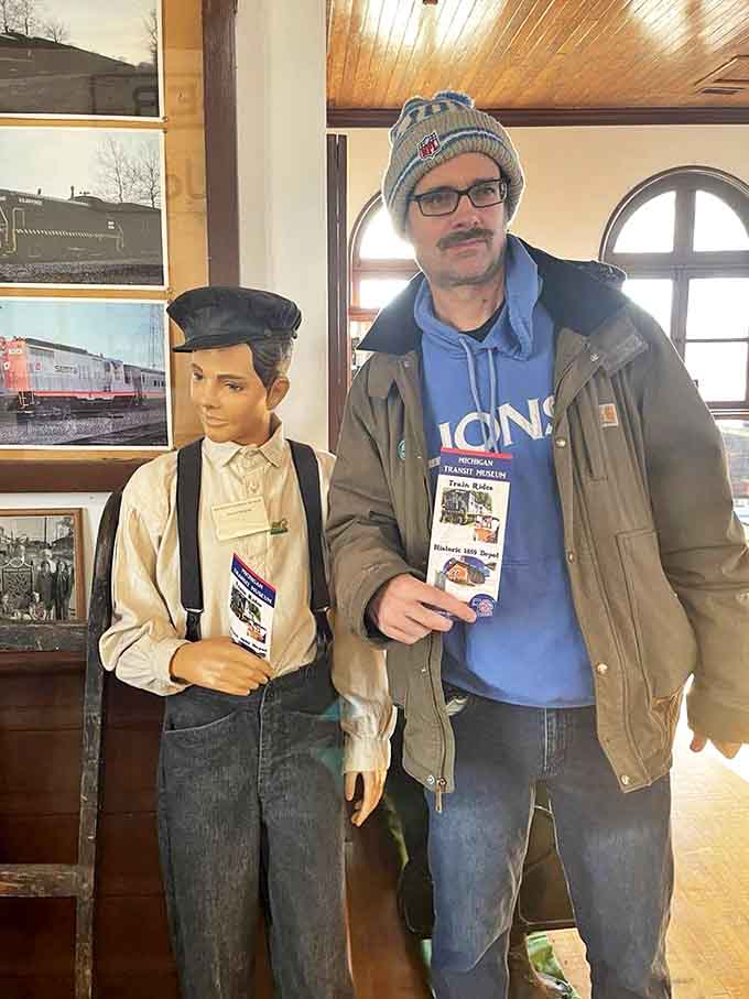 Museum visitors get up close with railroad history, including this life-sized figure of a young railroad employee from decades past.