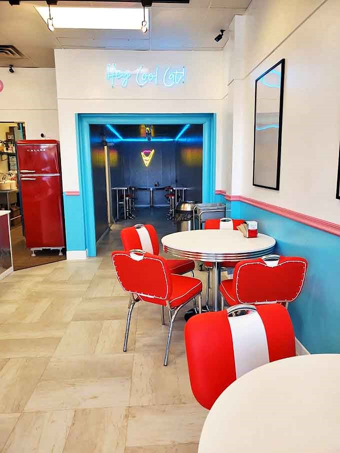Classic diner aesthetics meet ice cream dreams &ndash; red vinyl chairs practically begging for someone to spin around just once.