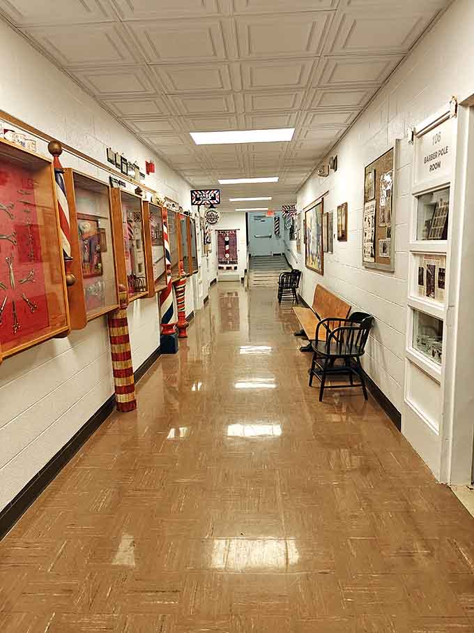 Walking these polished hallways feels like strolling through time, with each display case revealing another chapter in barbering history.