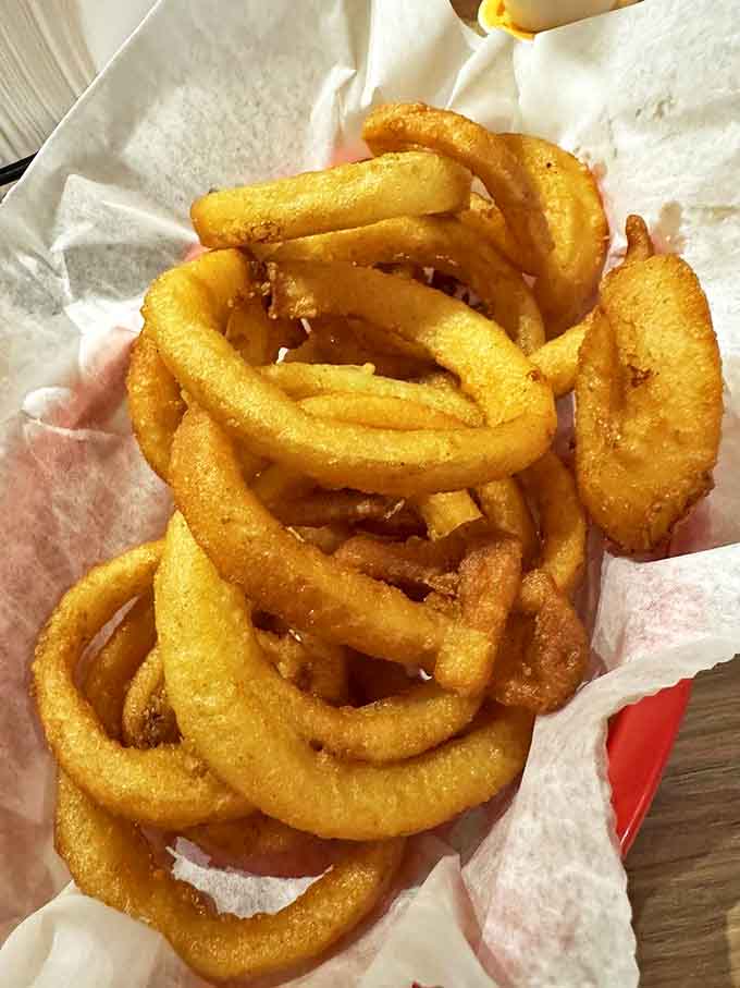These aren't your average onion rings &ndash; thick-cut sweet onions in golden batter that shatters with each bite, making fries jealous since 1924.