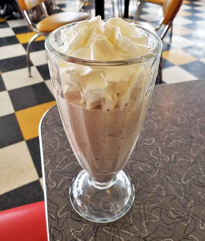 The Oreo shake stands tall and proud, a monument to dessert engineering that requires both a straw and a game plan.