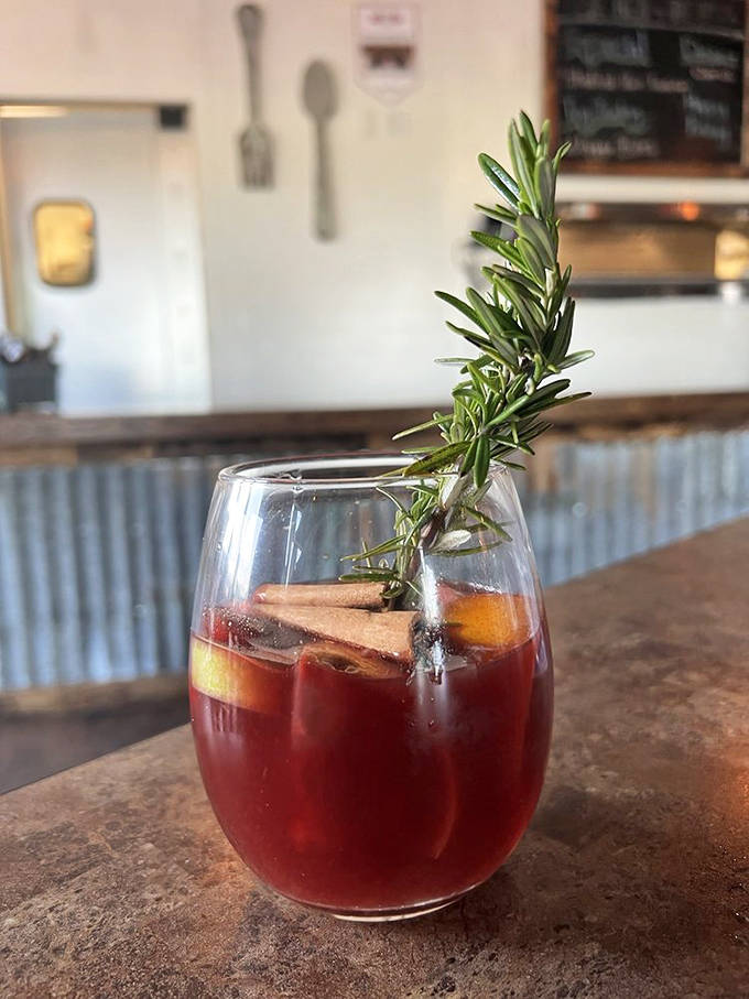 A sangria that's dressed better than most people, with rosemary sprig, cinnamon sticks, and fruit. Refreshing enough to justify ordering seconds.