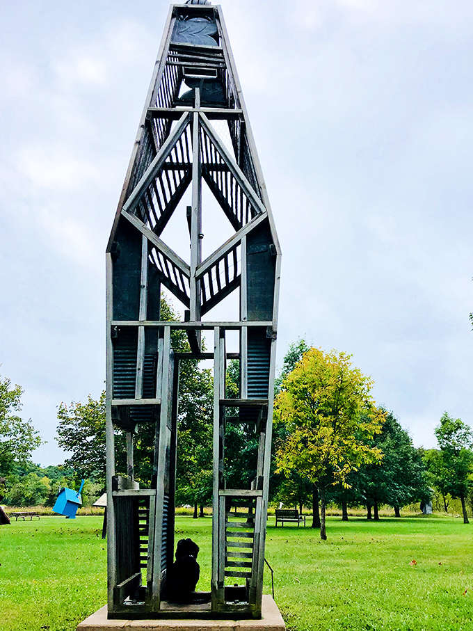 This boat-shaped metal framework creates a vessel for imagination, inviting visitors to mentally set sail across the grassy sea of the sculpture garden.