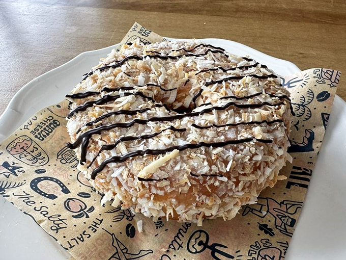 This coconut-topped creation channels tropical vibes with chocolate drizzle &ndash; like a vacation for your taste buds without leaving the table.