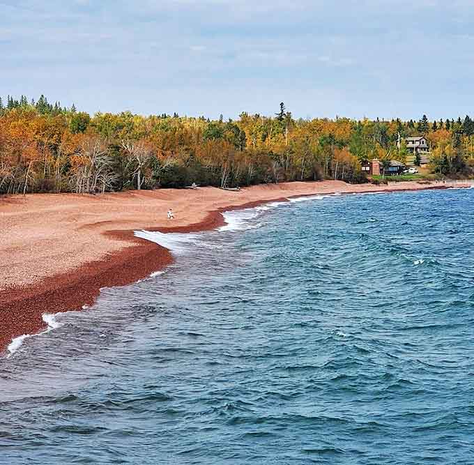 Autumn transforms the landscape into a painter's palette, with fall colors complementing the pink shoreline.
