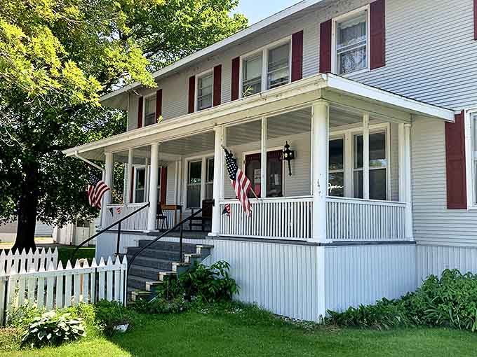 Side views reveal the inn's substantial presence in tiny Nahma, where it has stood as a community landmark for generations.