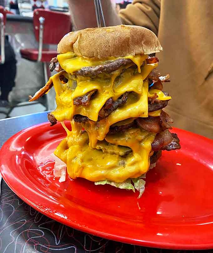 This cheeseburger stack defies gravity and common sense, oozing with enough melted cheese to fuel your wildest dreams.