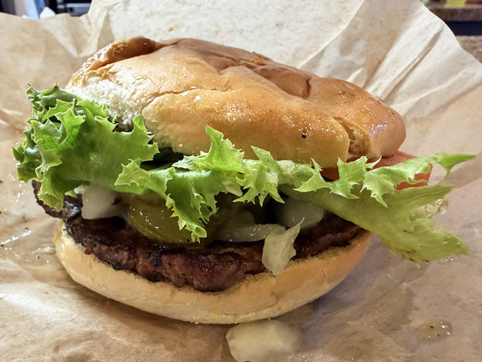 The classic burger in all its simple glory &ndash; proof that perfection doesn't need fancy ingredients or pretentious presentation.
